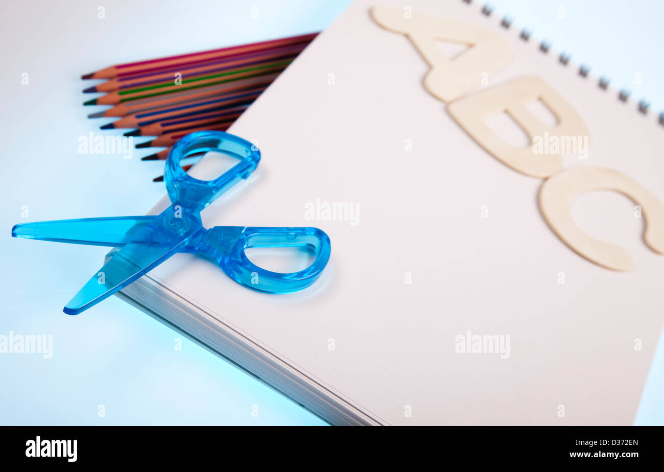Notebook, Alphabet and school supplies Stock Photo - Alamy
