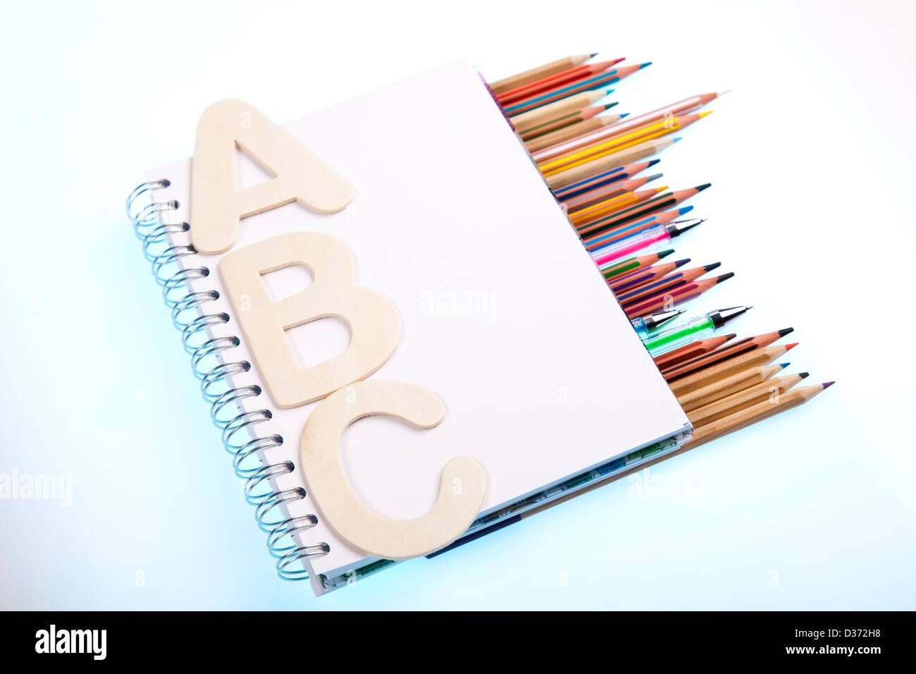 Notebook, Alphabet and school supplies Stock Photo - Alamy