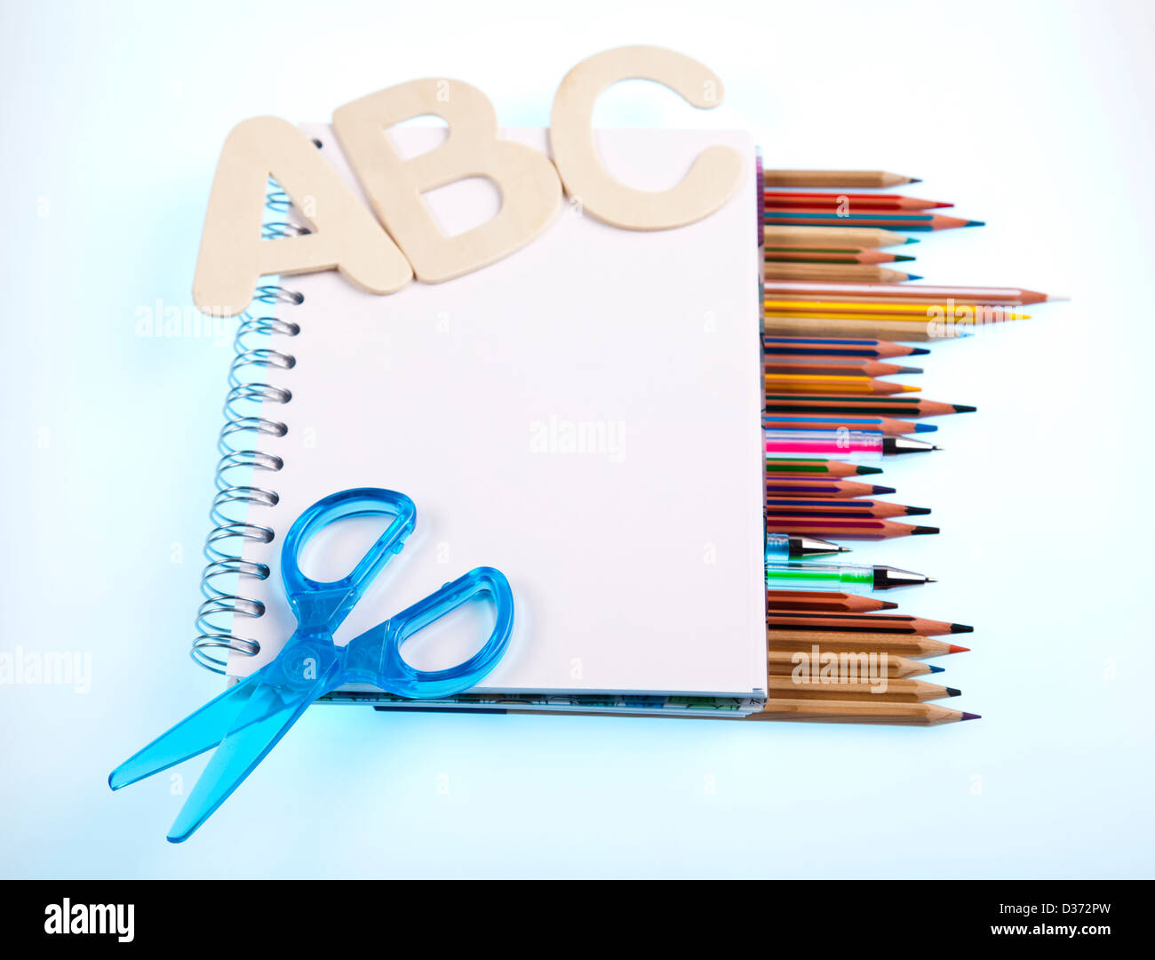 Notebook, Alphabet and school supplies Stock Photo - Alamy