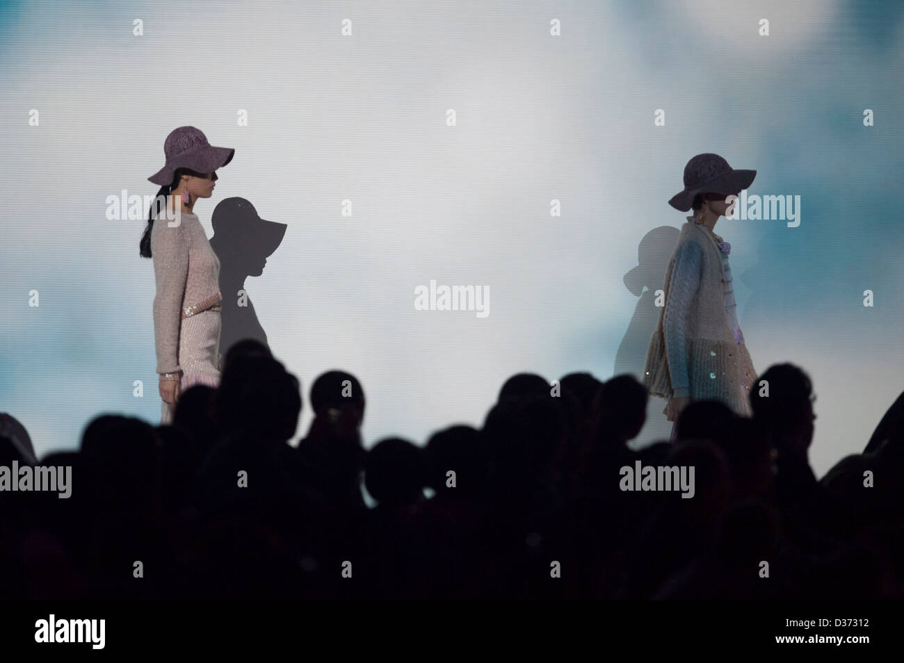 Two models showcase designs on the runway by Kay Wing Yuen during day 3 ...