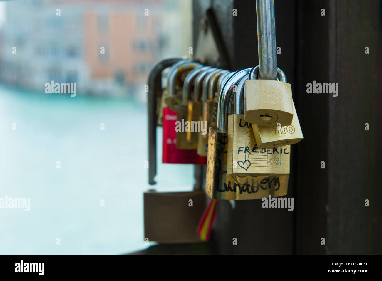 love padlocks like a love promise in the Accademia bridge in Venice ...