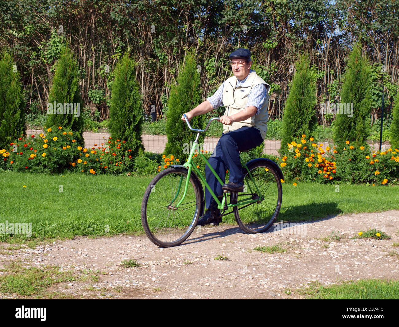 Old man on bicycle hi-res stock photography and images - Alamy