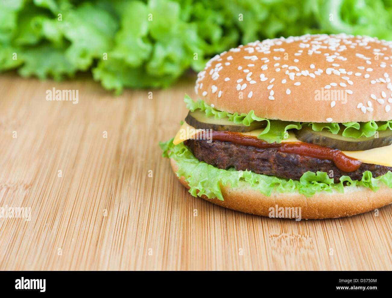 hamburger with meat cutlet and ketchup on wooden Stock Photo - Alamy