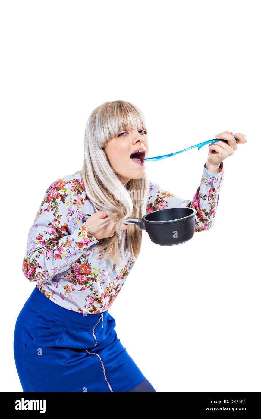 Beautiful girl holding pot and mixing it isolated on white background ...