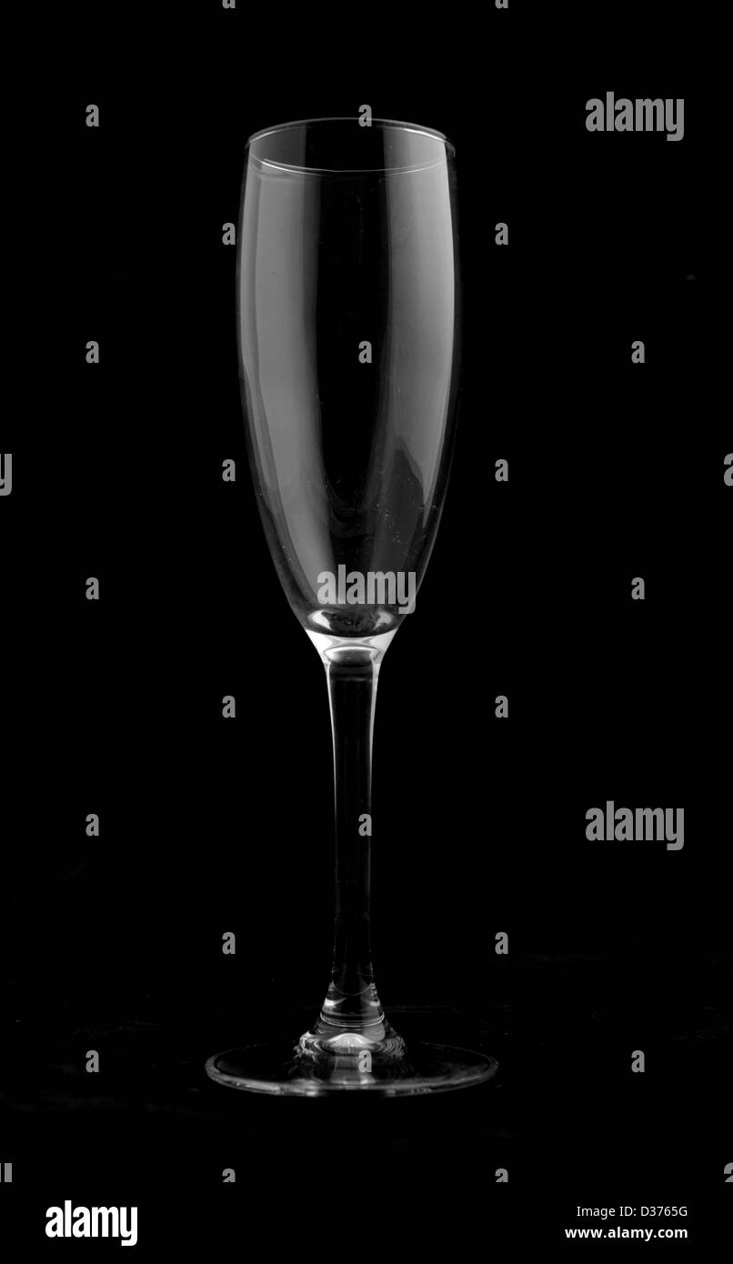 Champaign glass isolated on a black background Stock Photo - Alamy