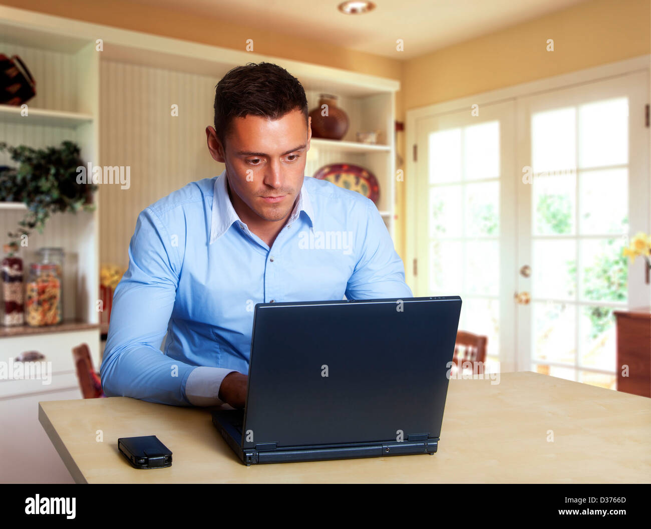 Man working at laptop computer Stock Photo - Alamy
