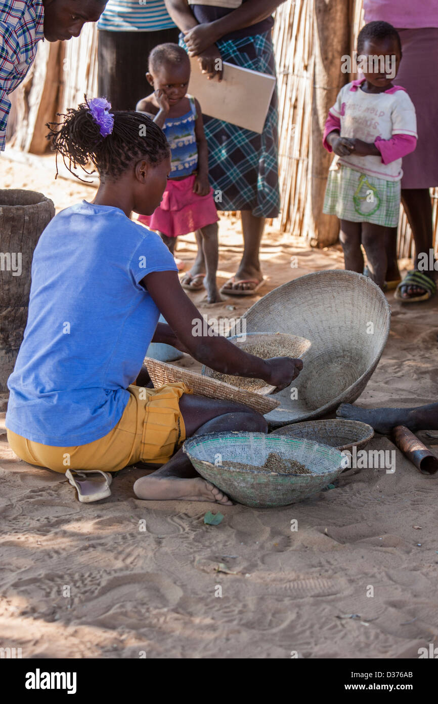 African woman sifting food Stock Photo - Alamy