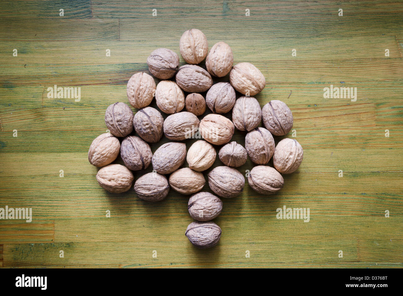 tree made from walnuts on the vintage wooden background Stock Photo - Alamy