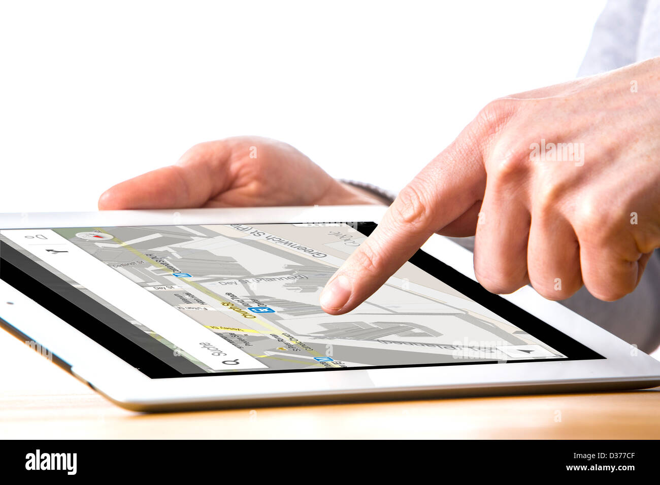 Person is using a tablet computer. City map navigation Stock Photo - Alamy