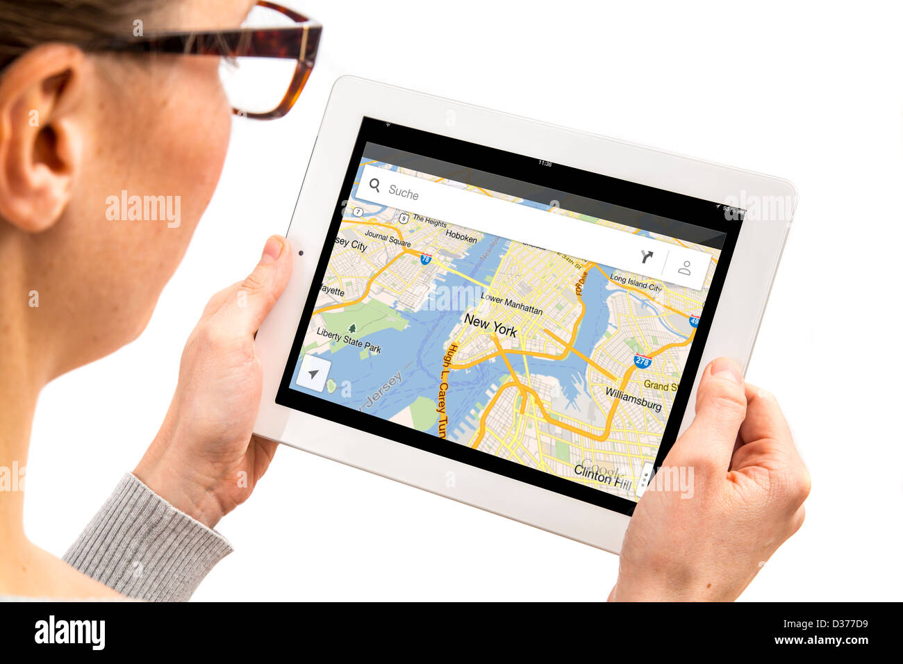 Person is using a tablet computer. city map, navigation Stock Photo - Alamy