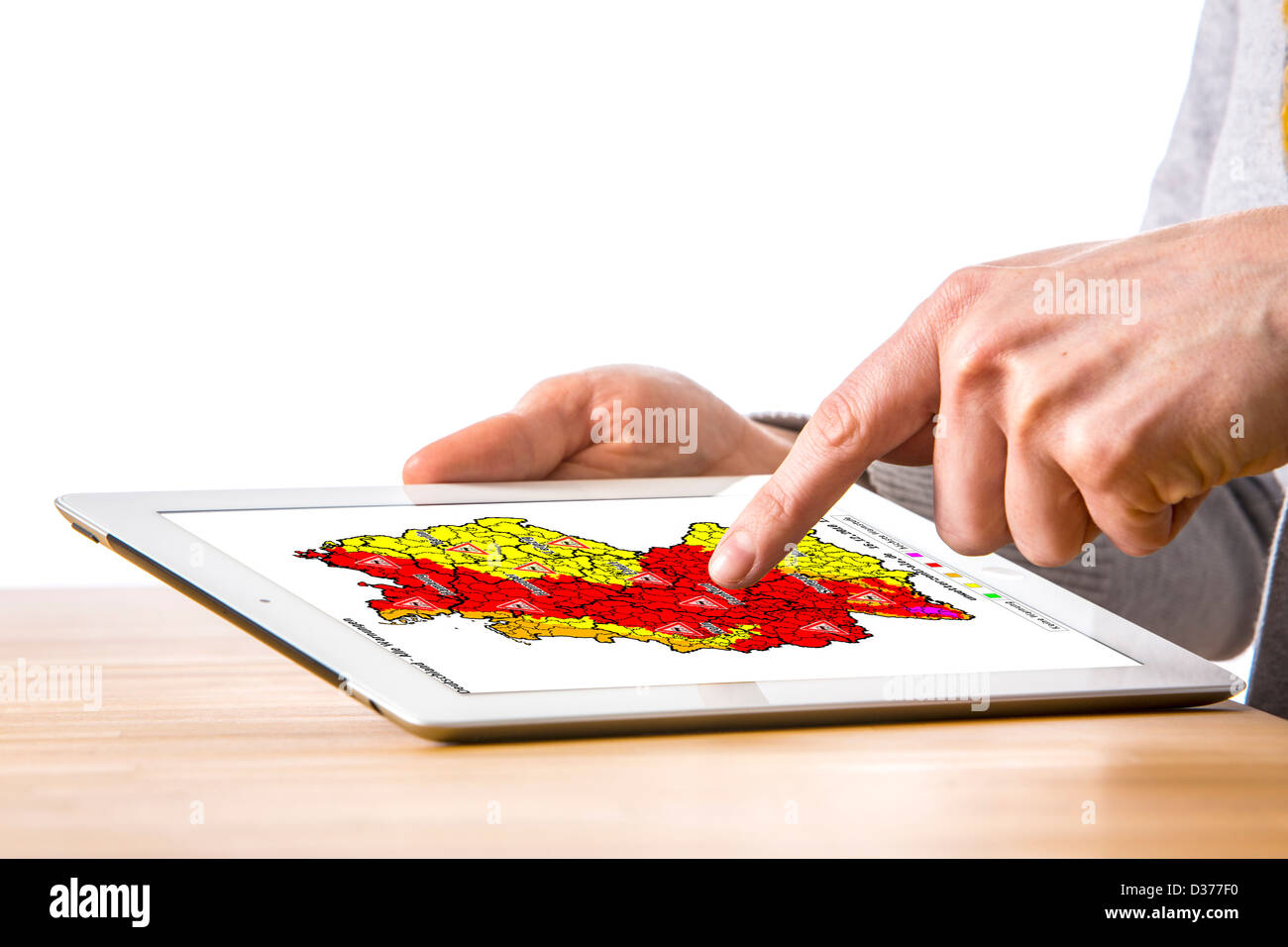 Person is using a tablet computer. Weather forecast site Stock Photo ...