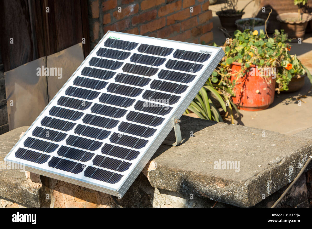 A tiny solar photo voltaic panel on a rooftop in Kathmandu, big enough ...