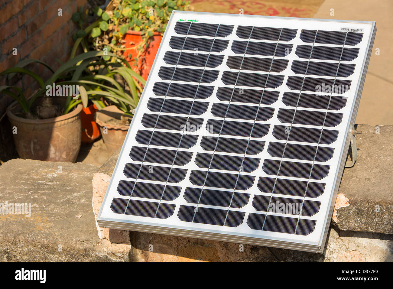 A tiny solar photo voltaic panel on a rooftop in Kathmandu, big enough ...
