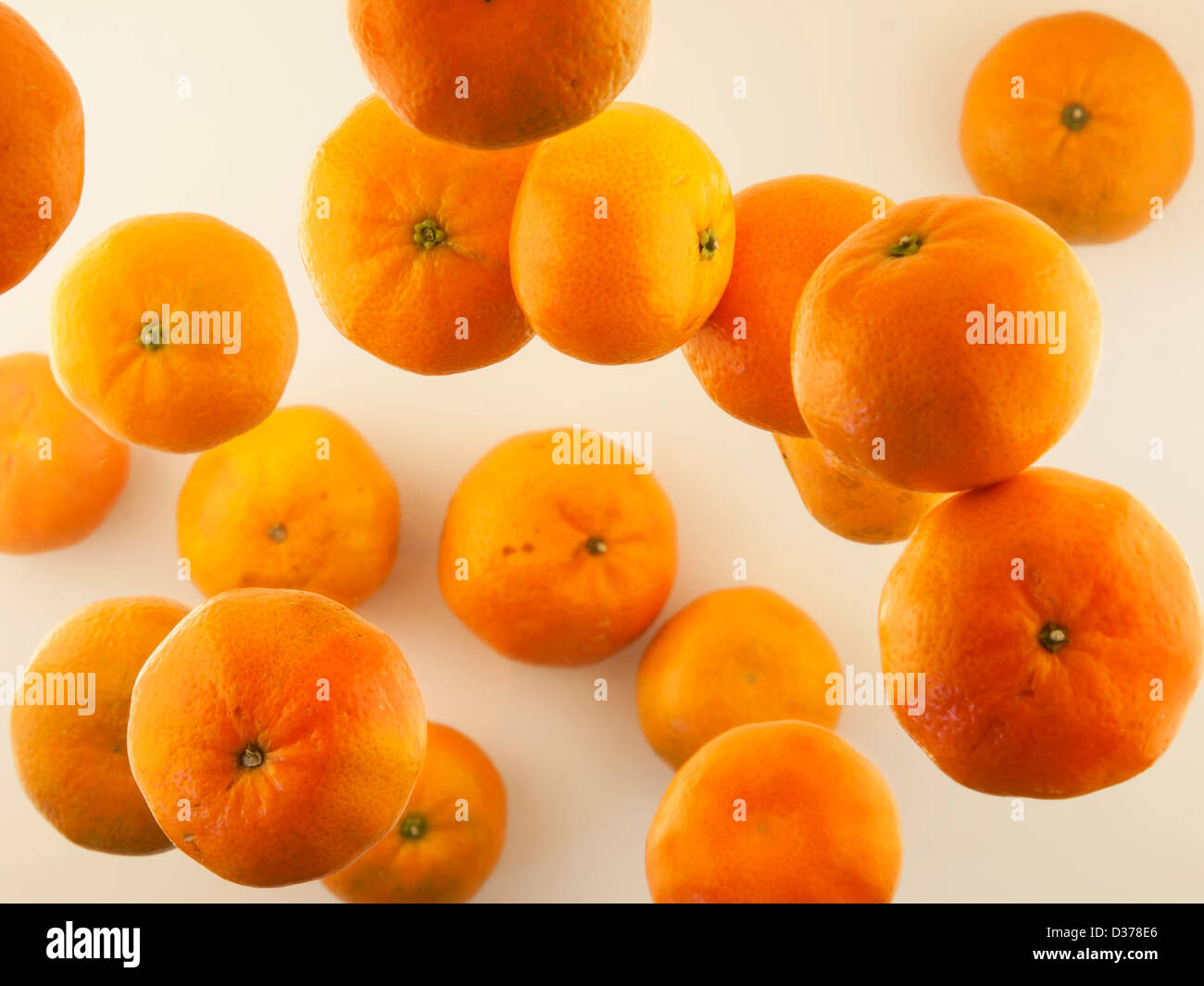 floating oranges on a white background Stock Photo - Alamy