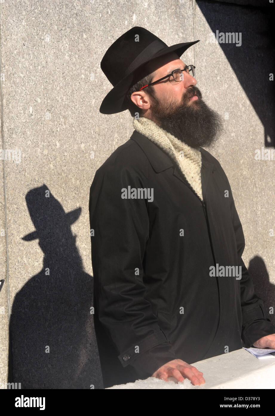 Hasid man in prayer at the Ohel at Montefiore cemetery in Cambria ...