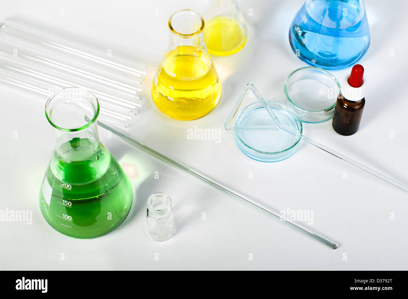 Laboratory glassware equipment. Laboratory beakers filled with colored ...