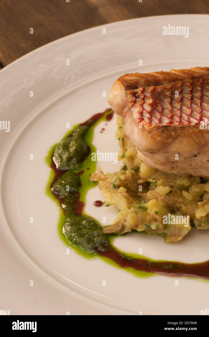 Red snapper with colcannon potatoes, red wine syrup and coriander pesto ...