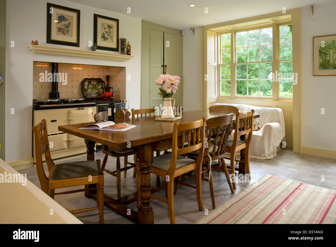 A traditional farmhouse style kitchen with Aga cooker Stock Photo - Alamy