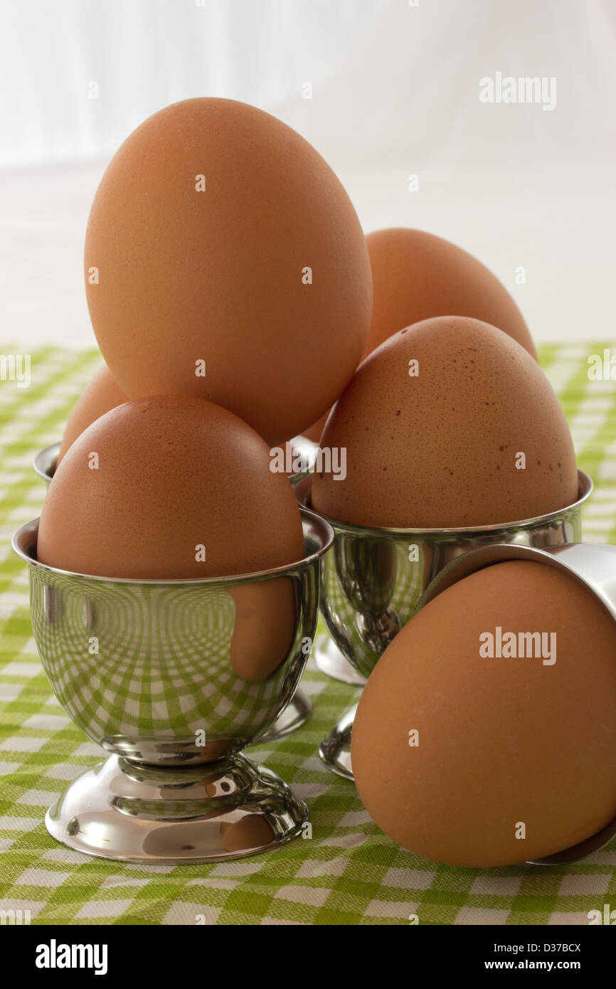 Stacked eggs and egg cups Stock Photo - Alamy
