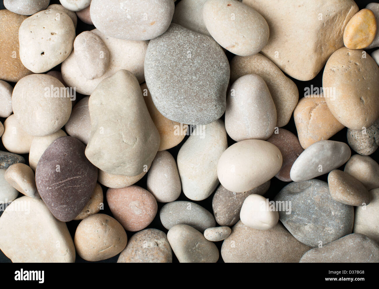 Scattered stones for background. Studio shot Stock Photo - Alamy