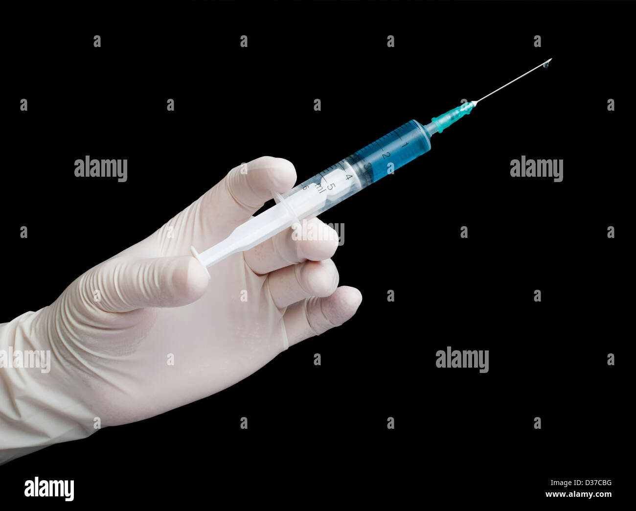 Hand hold medical syringe. Black isolated studio shot Stock Photo - Alamy