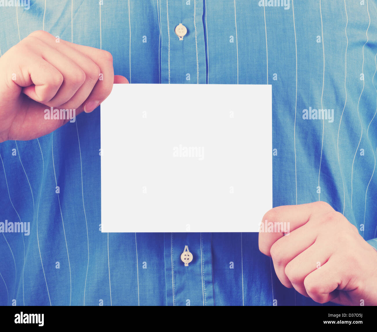 Closeup of businessman's hand holding up card Stock Photo - Alamy