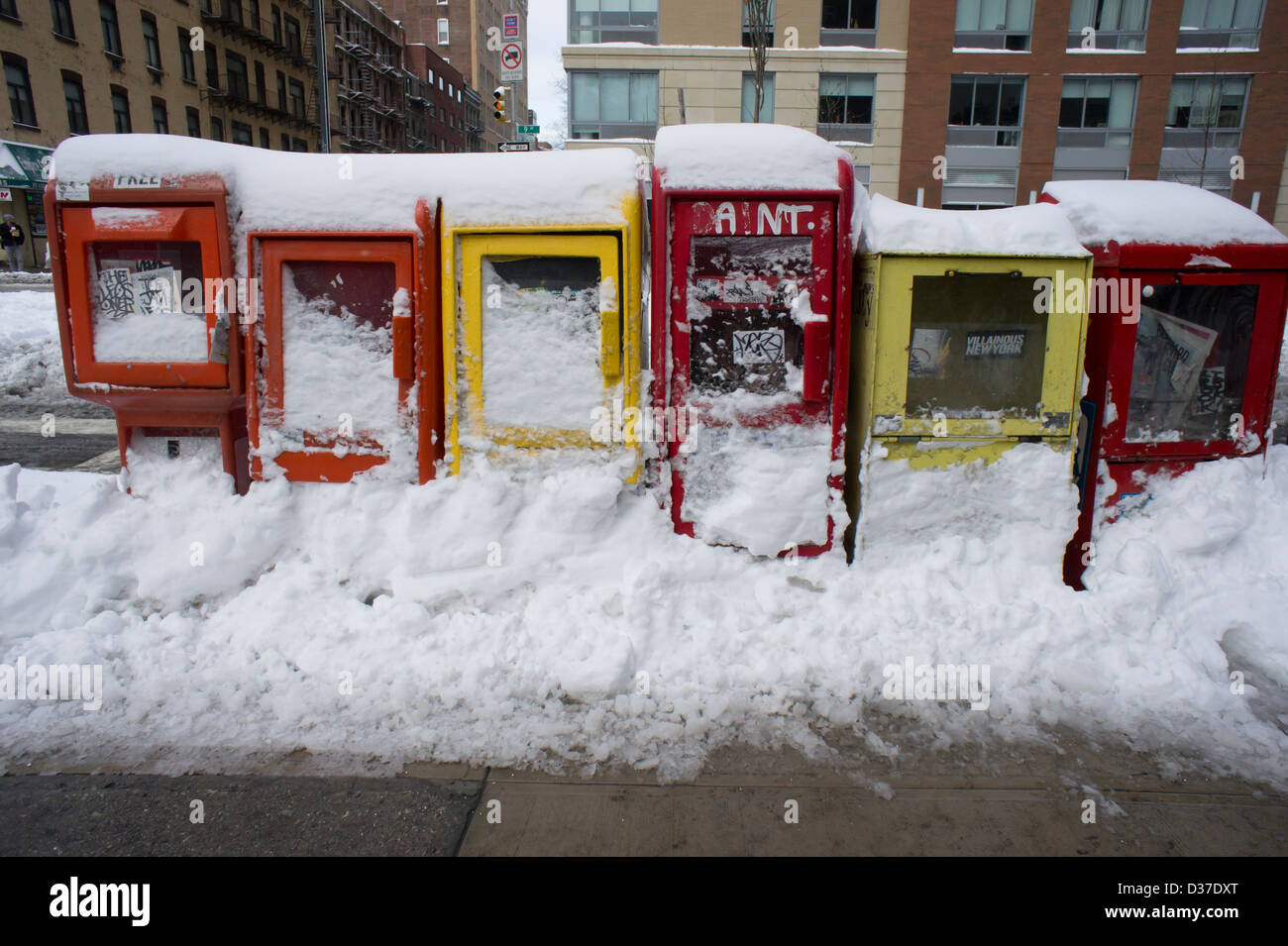 Newspaper boxes covered with snow in the Chelsea neighborhood of New ...