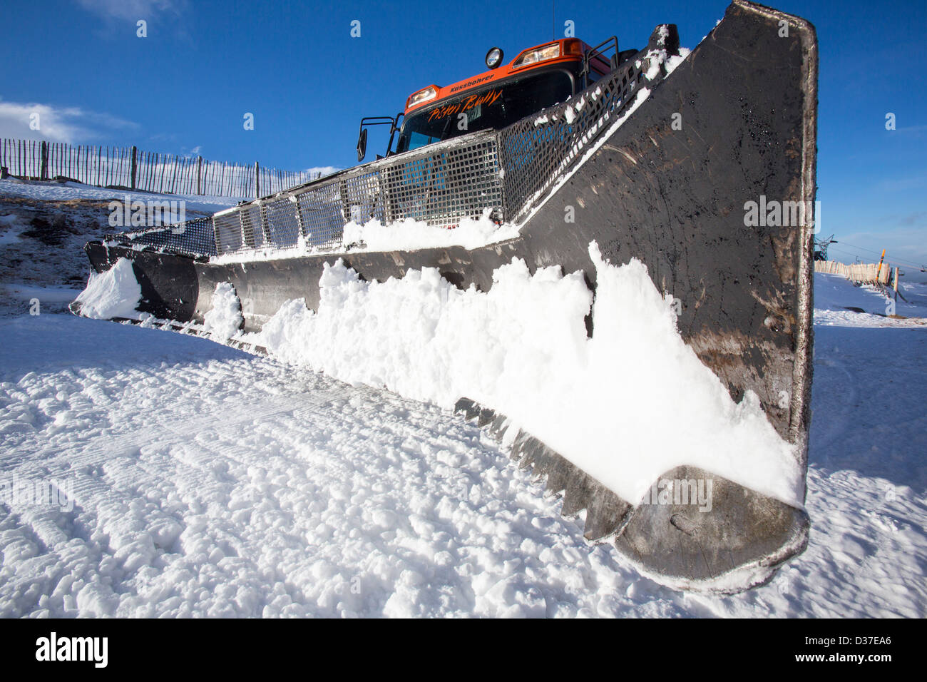 A piste basher on a ski run in the Cairngorm mountains. climate change ...