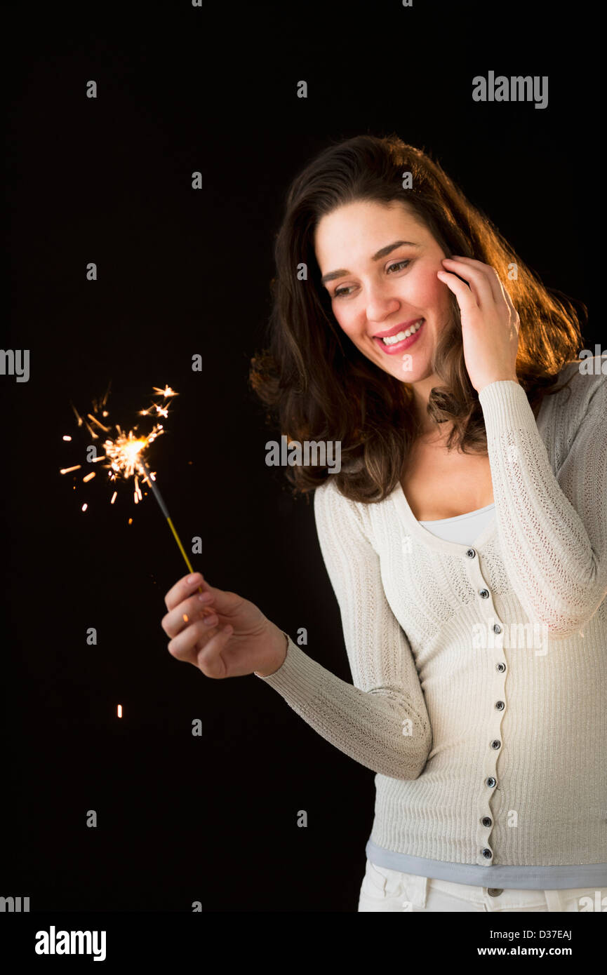 Portrait woman holding sparkler hi-res stock photography and images - Alamy