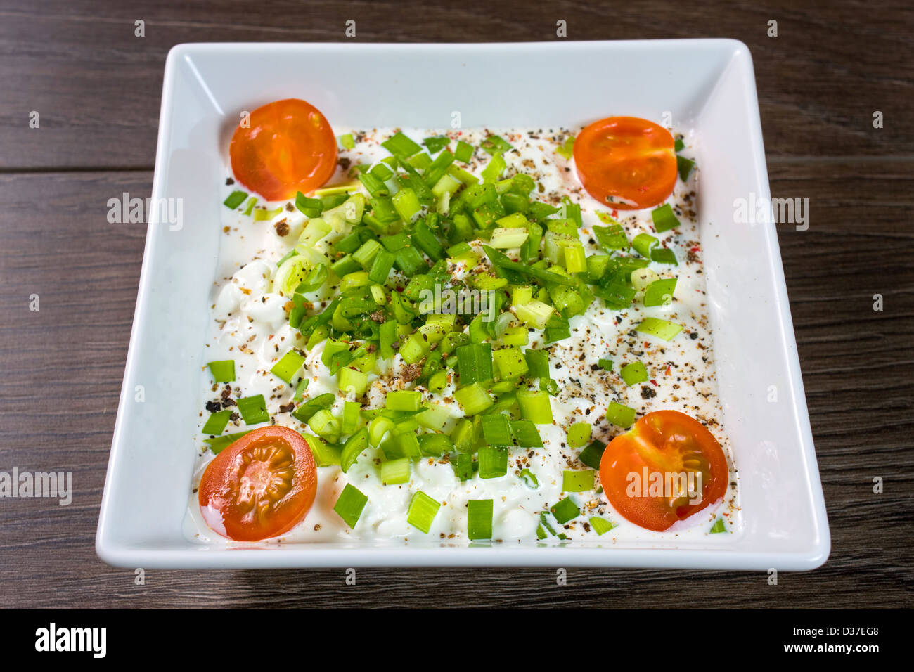 Bowl with fresh cottage cheese and chives Stock Photo - Alamy