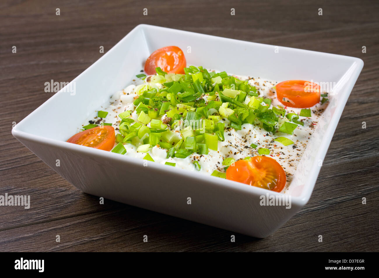 Bowl with fresh cottage cheese and chives Stock Photo - Alamy