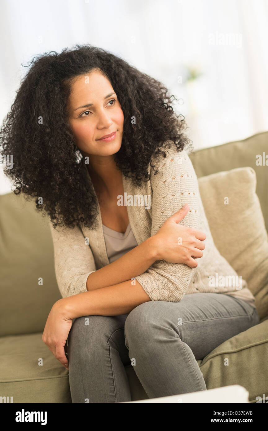 USA, New Jersey, Jersey City, Portrait of mid adult woman sitting on ...