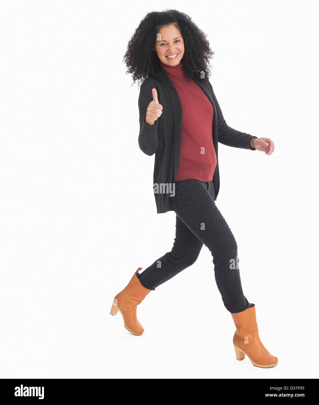 Walking mid adult woman Cut Out Stock Images & Pictures - Alamy
