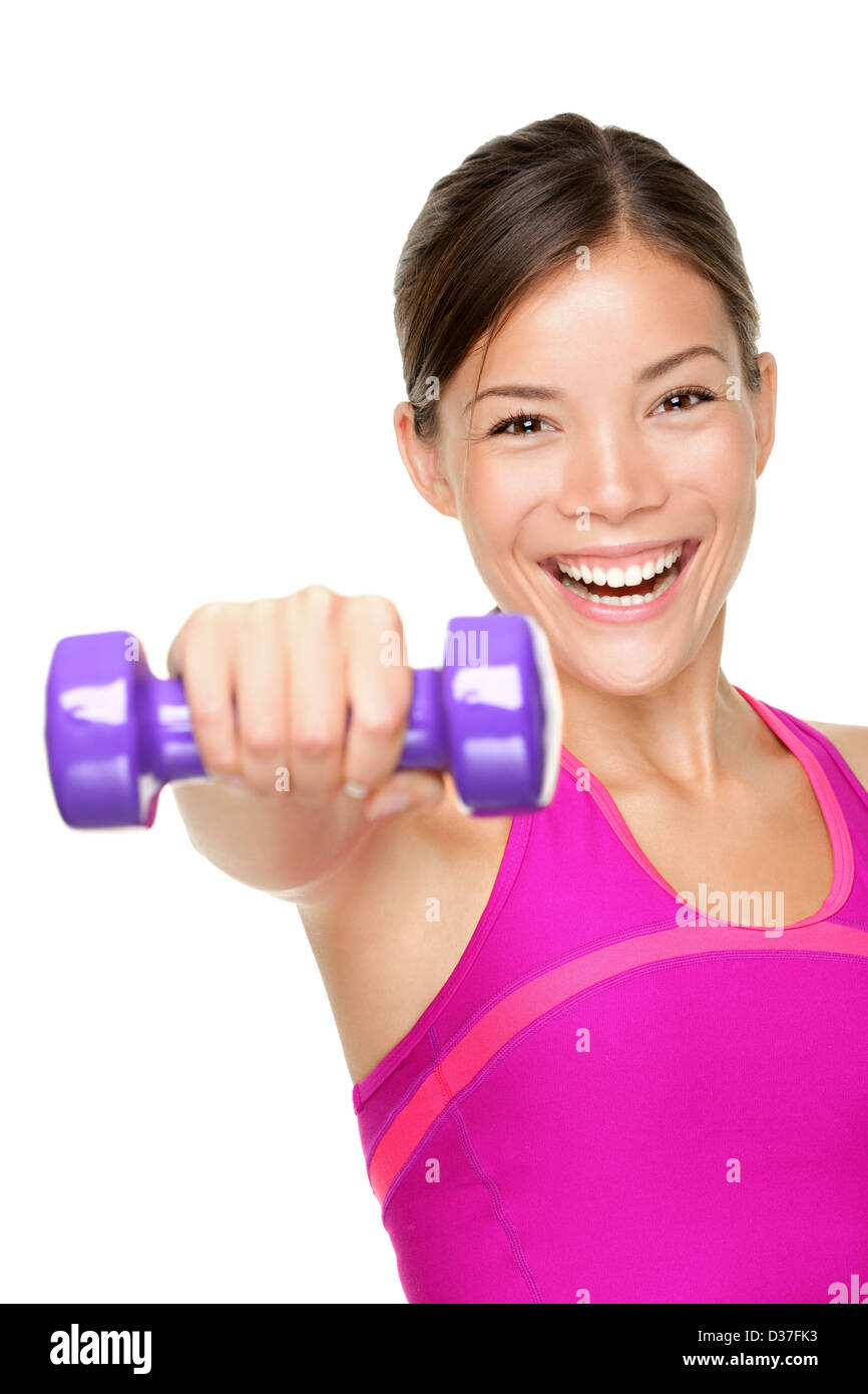 Portrait of smiling Caucasian Asian fit woman lifting weights isolated ...