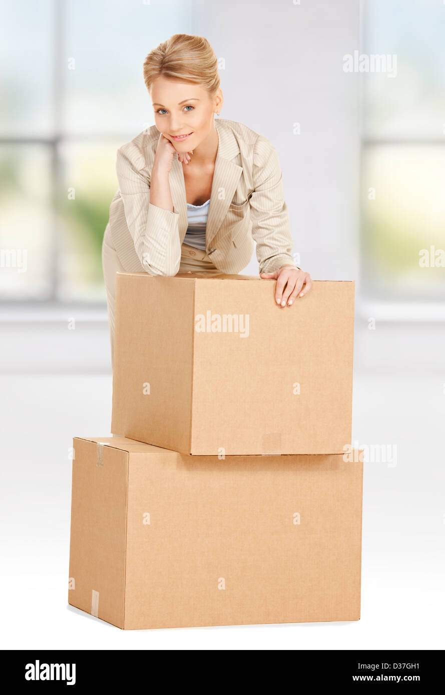 attractive businesswoman with big boxes Stock Photo - Alamy
