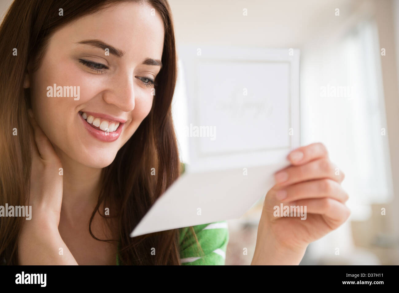 USA, New Jersey, Jersey City, Young woman reading letter Stock Photo ...