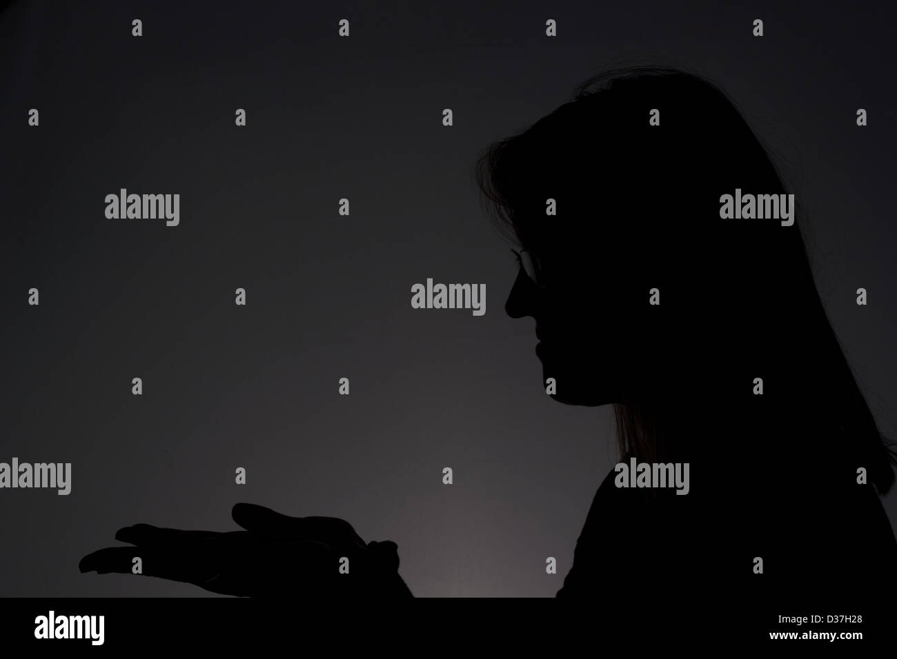 Woman showing something Stock Photo - Alamy