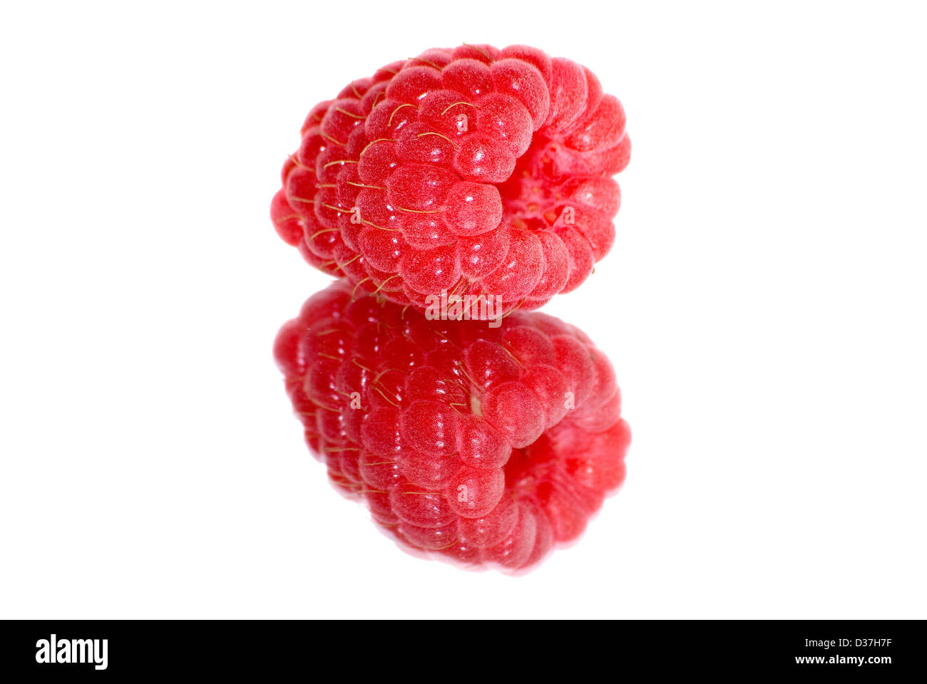 Berry of a raspberry are reflected in a mirror Stock Photo - Alamy