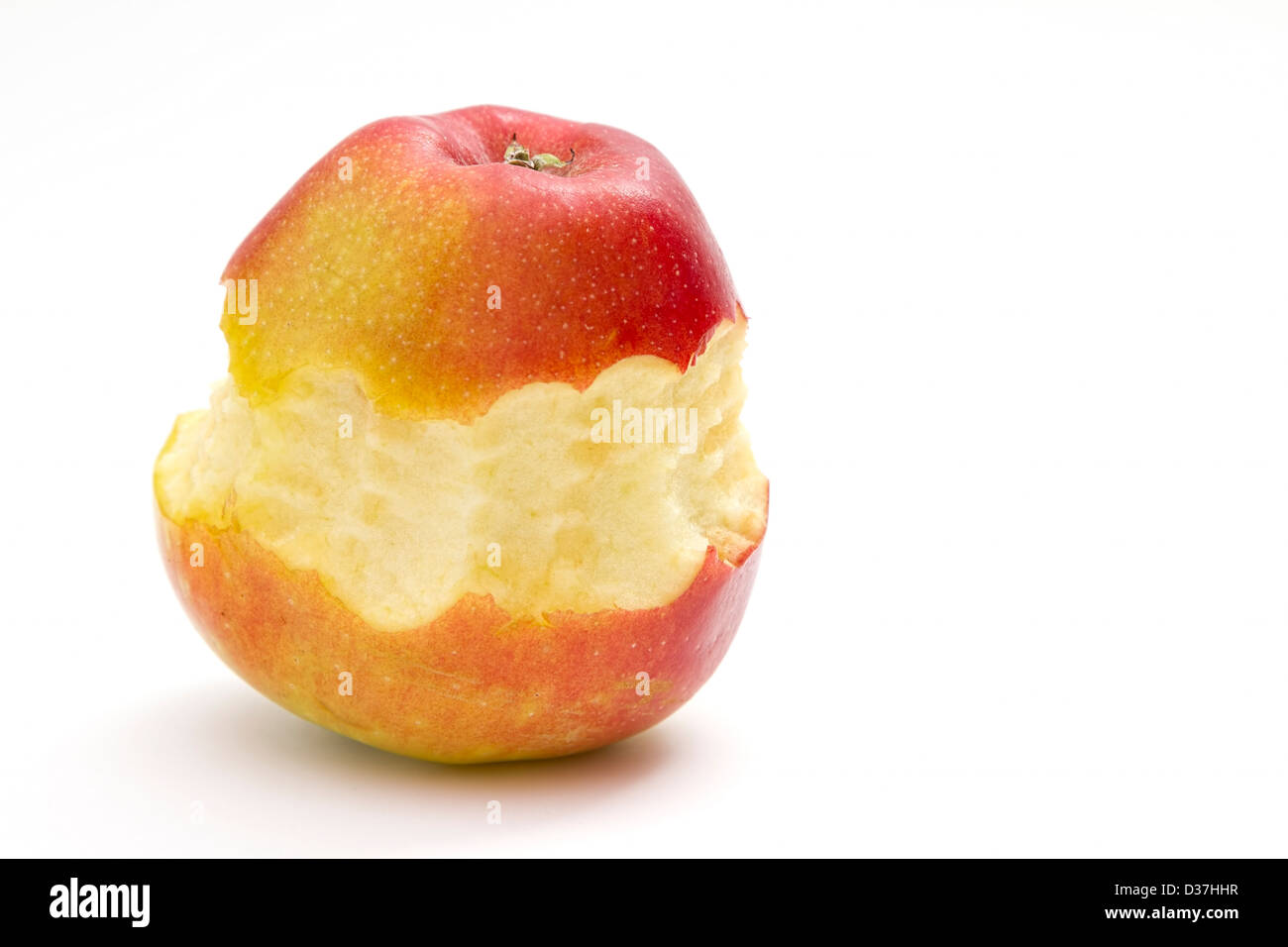 Part eaten ripe apple on white background Stock Photo - Alamy