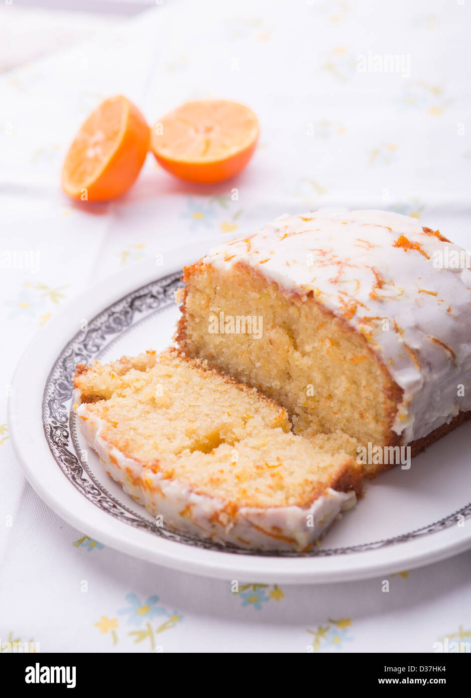 Citrus lemon orange clementine drizzle iced sponge cake homemade on a ...