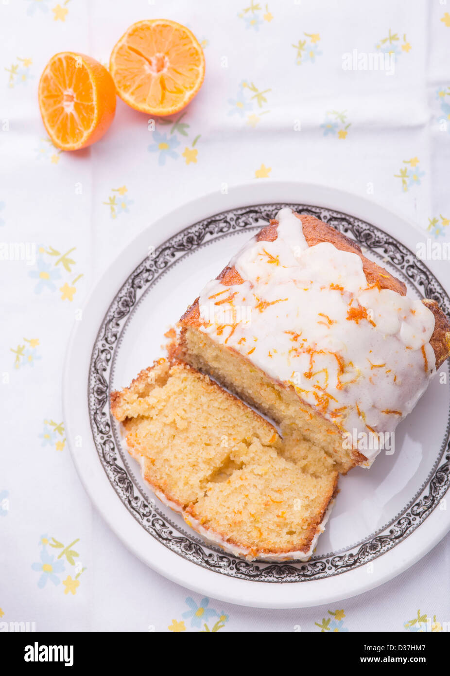 Citrus lemon orange clementine drizzle iced sponge cake homemade on a ...