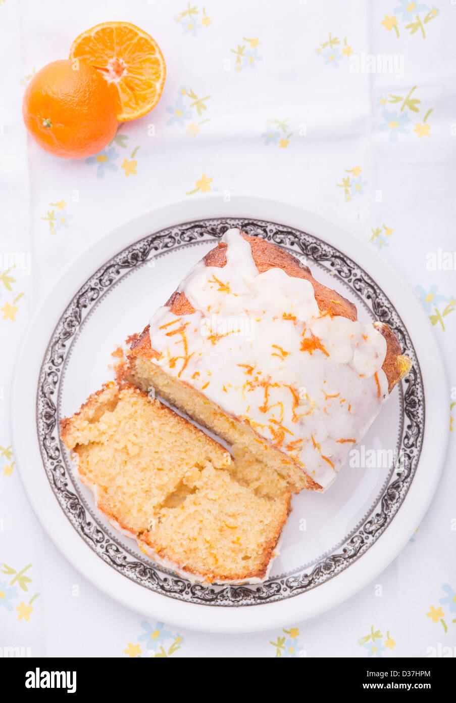 Citrus lemon orange clementine drizzle iced sponge cake homemade on a ...