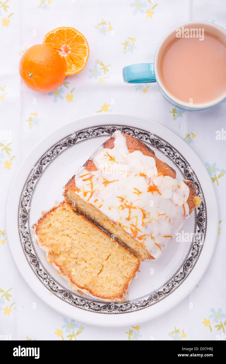 Citrus lemon orange clementine drizzle iced sponge cake homemade on a ...
