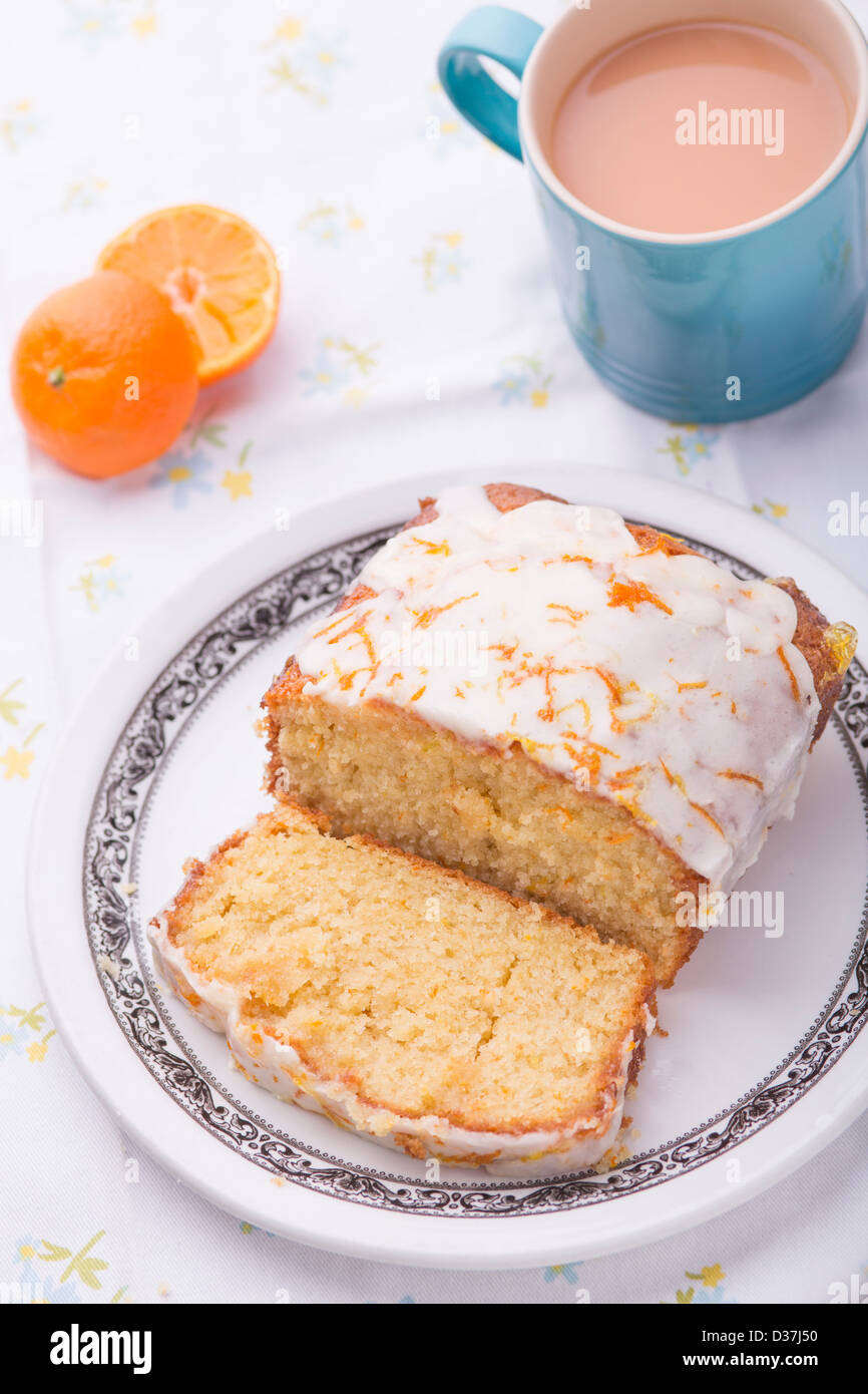 Citrus lemon orange clementine drizzle iced sponge cake homemade on a ...