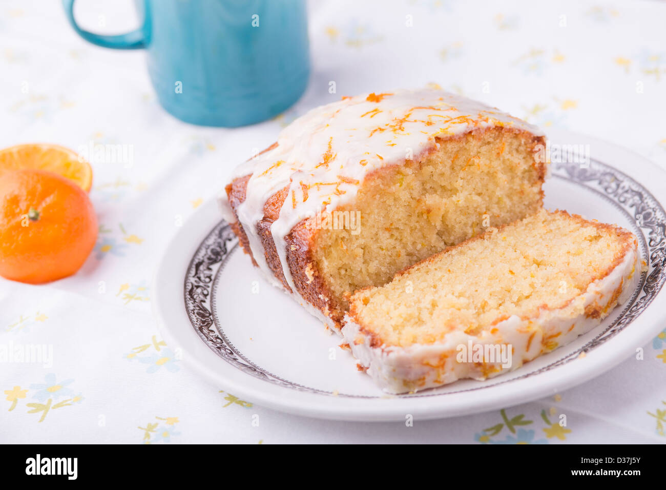 Citrus lemon orange clementine drizzle iced sponge cake homemade on a ...