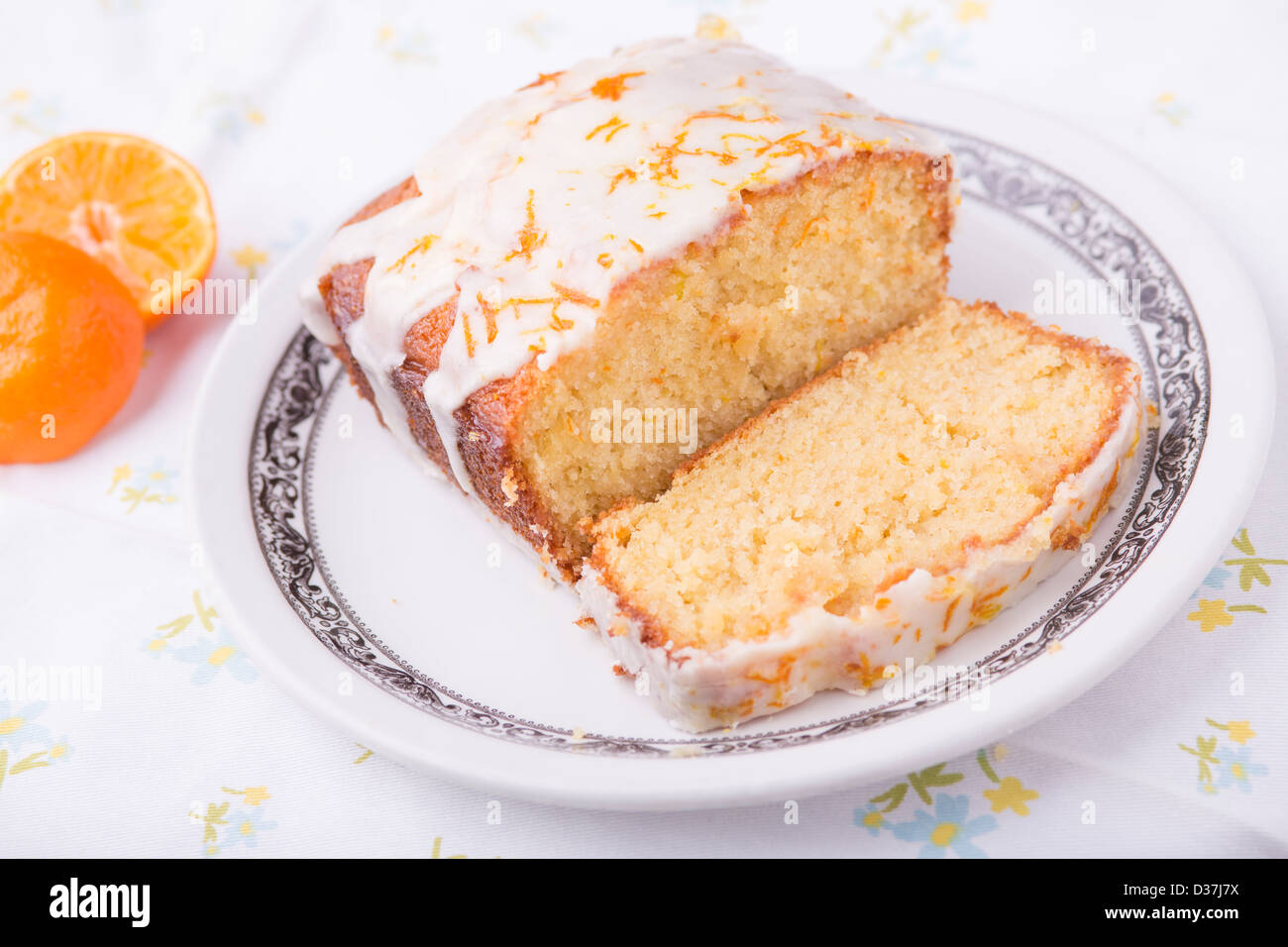 Citrus lemon orange clementine drizzle iced sponge cake homemade on a ...