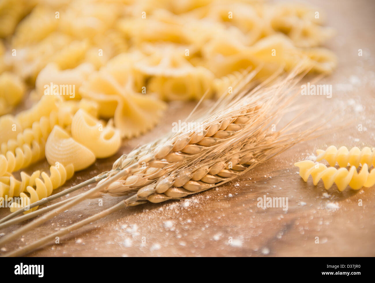 Different types of pasta and wheat ear Stock Photo - Alamy