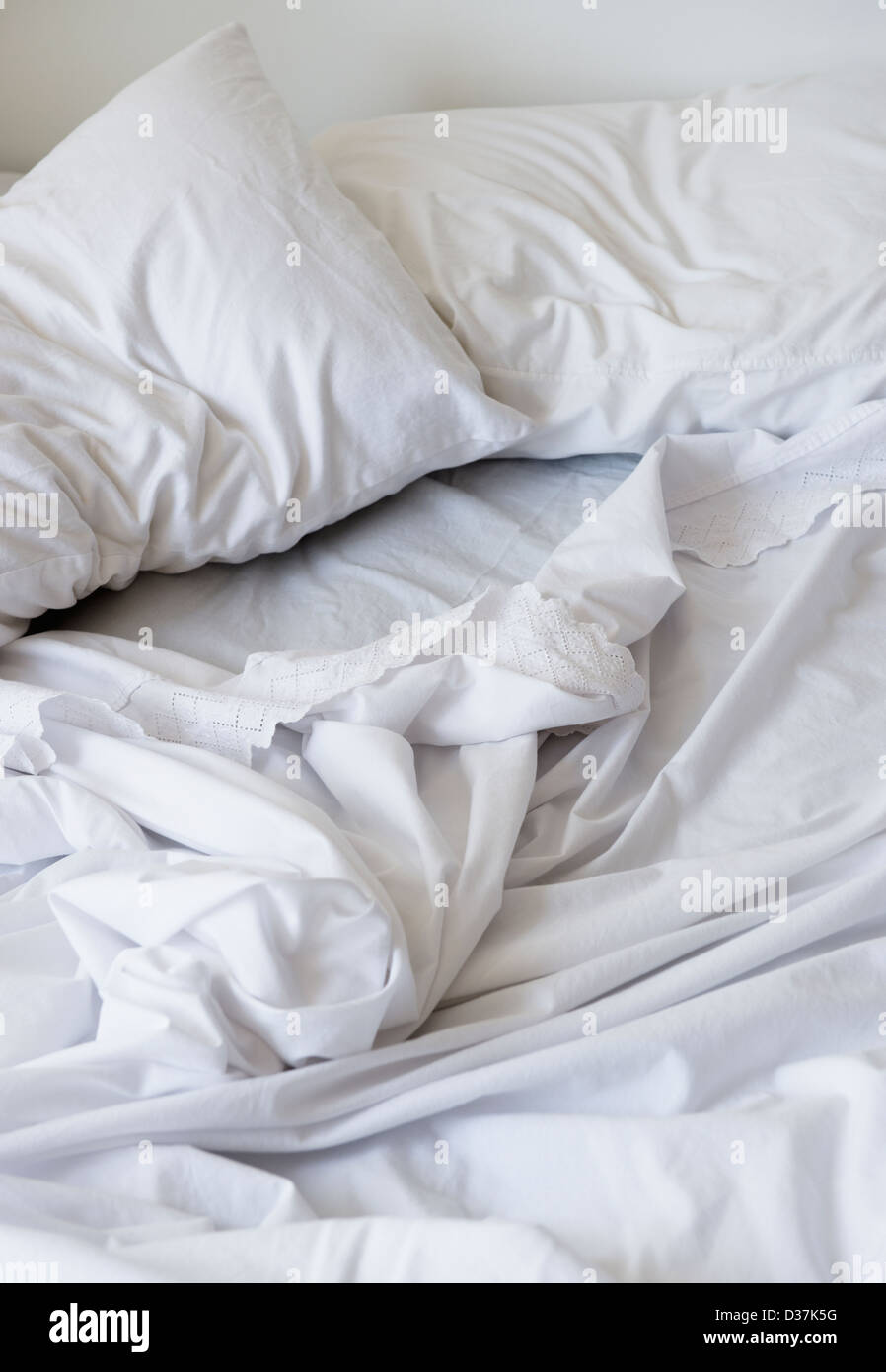 White bedclothing in mess Stock Photo - Alamy
