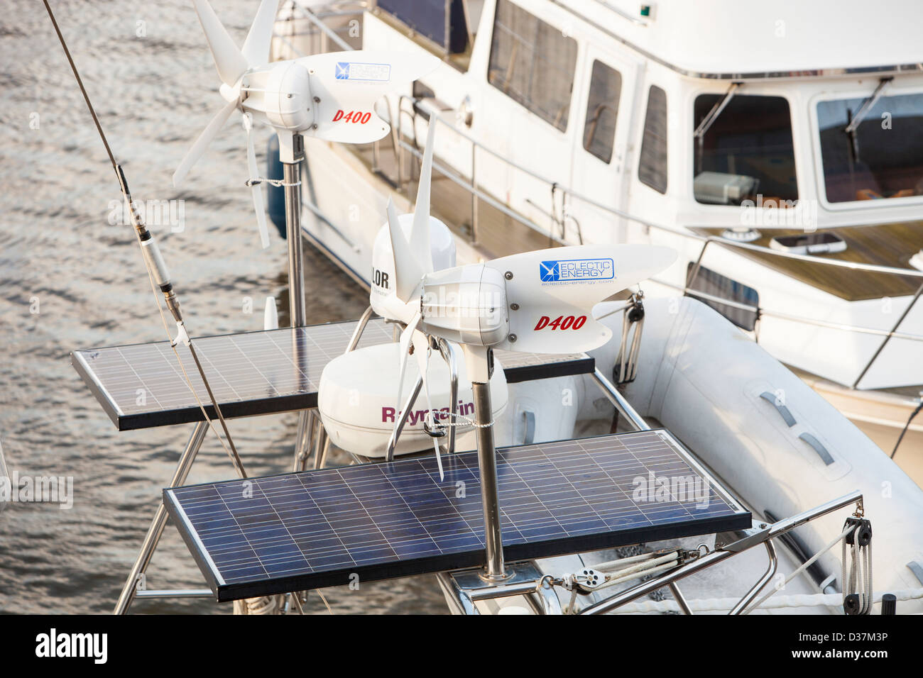 Solar panels and wind turbines to provide power on a yacht Stock Photo ...
