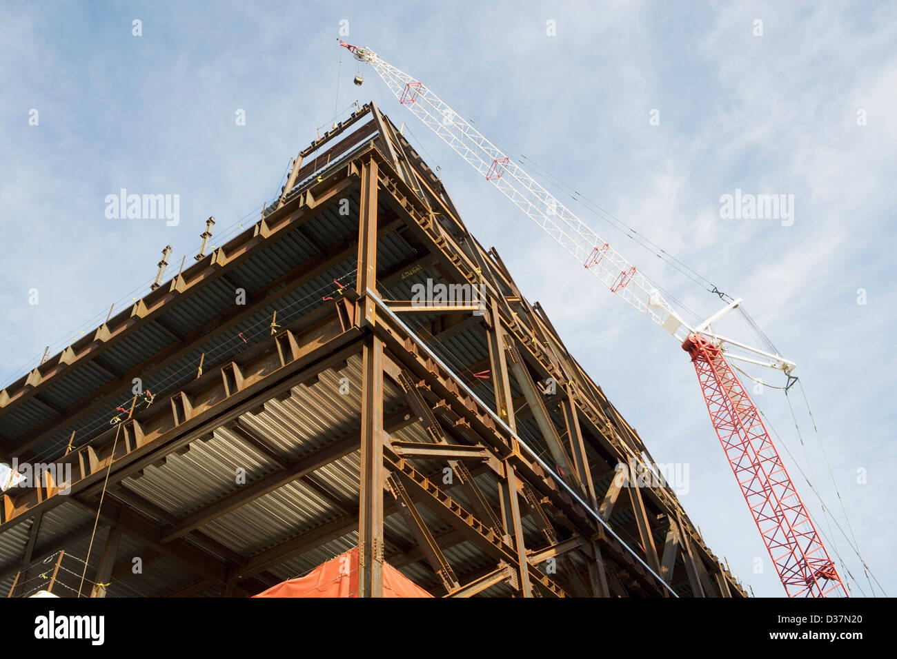 Crane over building under construction Stock Photo - Alamy
